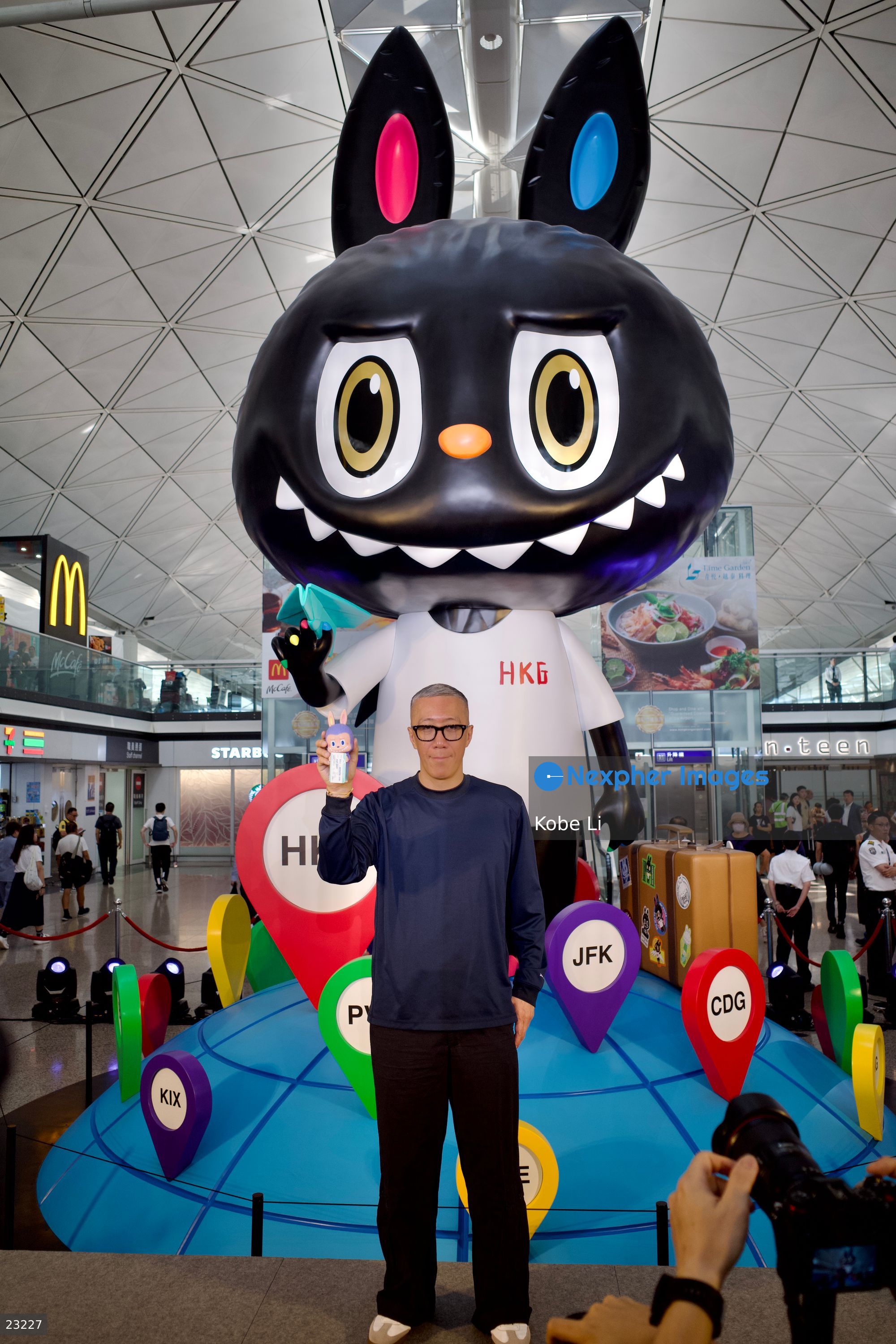 Hong Kong artist Kasing Lung posing photo at the LABUBU event in ...